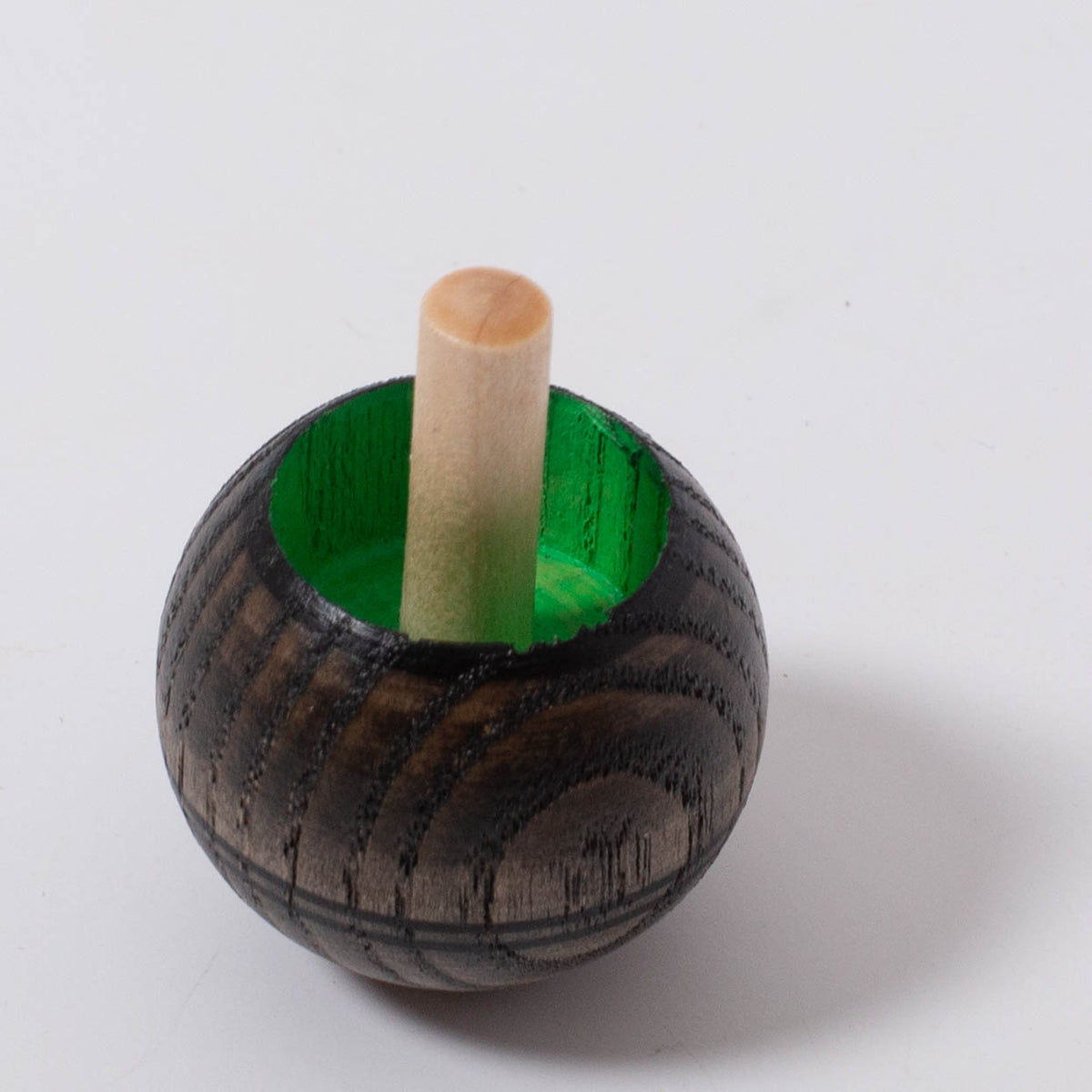 Turn over Spinning Top in grey with red or green | Conscious Craft